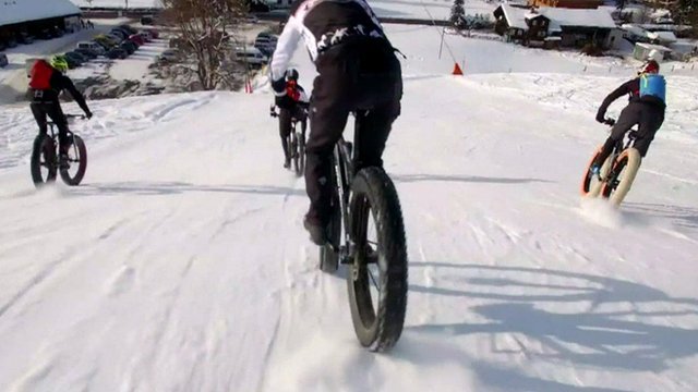 Snow bikes race through the Alps - BBC News