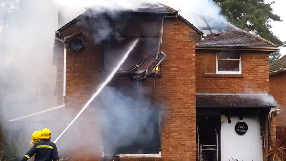 Man charged with arson after West Moors house fire - BBC News