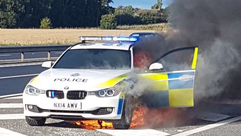 Police car bursts into flames in road near Topcliffe - BBC News