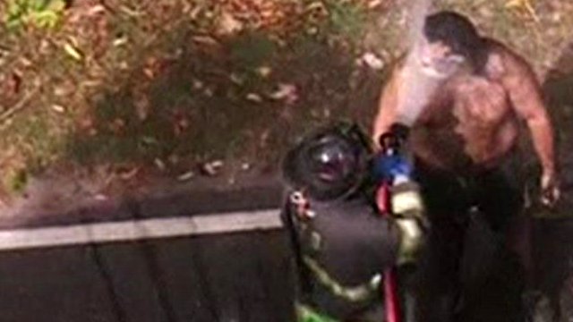 Man hosed down after rescue from storm drain - BBC News