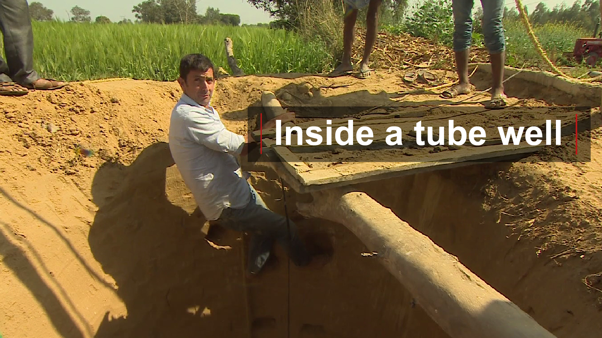 Climbing inside a tube well in rural India - BBC News