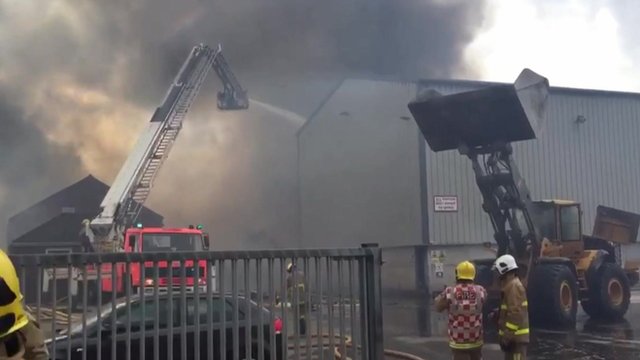Crews tackle large sawdust mill fire in Lancashire - BBC News