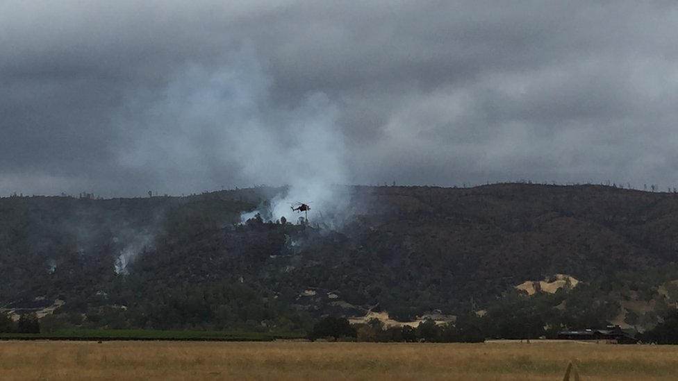 US wildfires death toll rises to five - BBC News