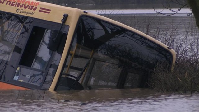 School bus trapped by flood water near York - BBC News