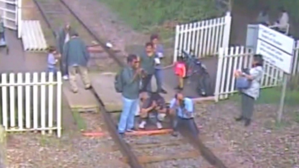 Indian woman survives after being run over by a train - BBC News