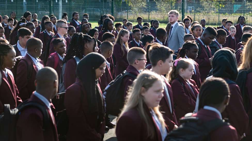 Millions of pupils return after historic shutdown - BBC News