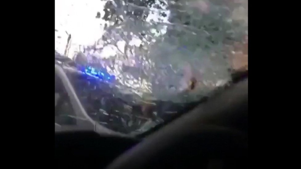 Video appears to show police officer smash car window - BBC News