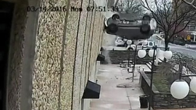 Driver survives fall from rooftop car park - BBC News