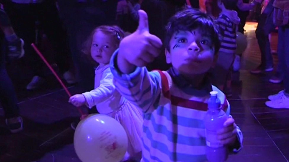 Fatboy Slim gets down with the children at kids' rave - BBC News