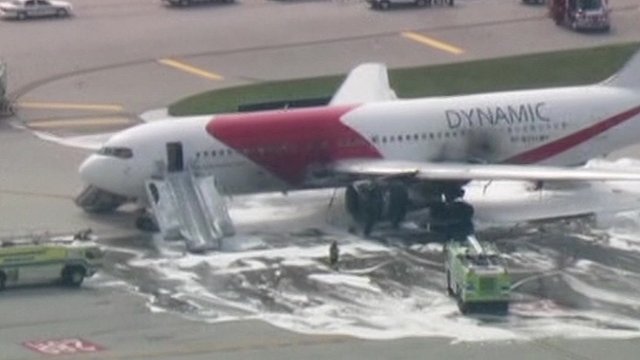 Plane catches fire on Florida runway - BBC News