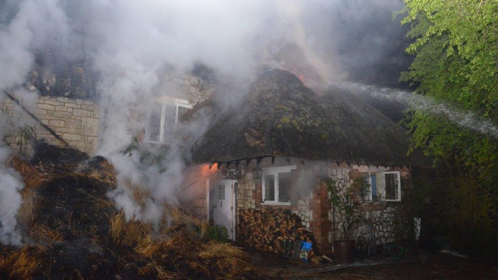 Thatched roof destroyed in Knighton cottage blaze - BBC News