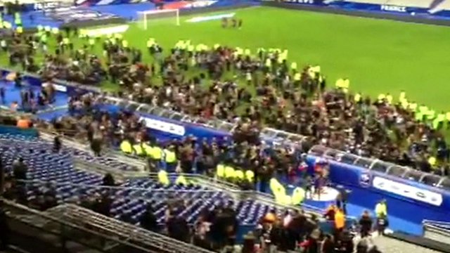 Paris attacks: Held fans evacuated from stadium - BBC News