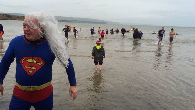 Hundreds take part in New Year's Day swims - BBC News