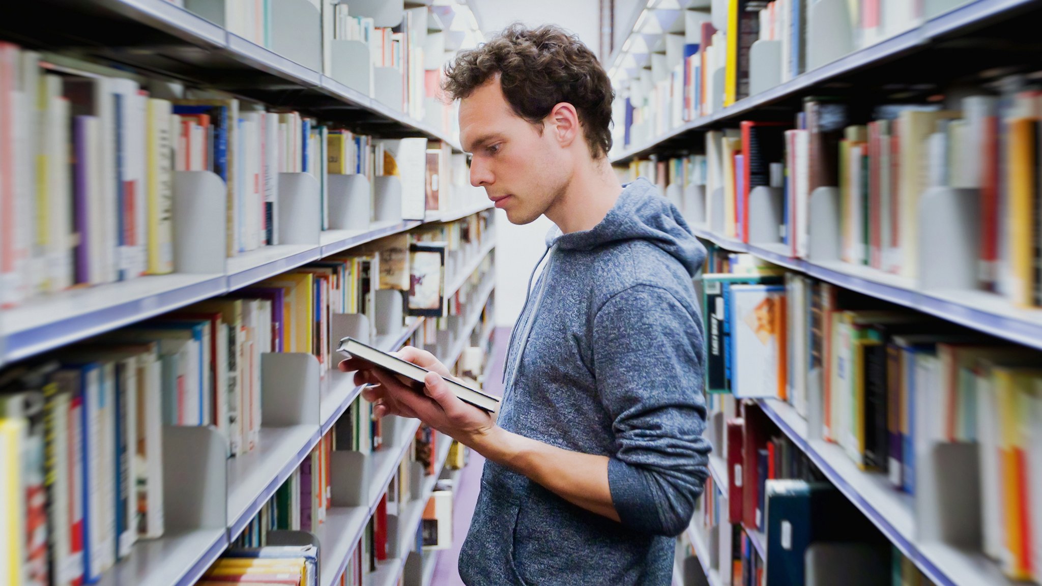 Student Studying In Library