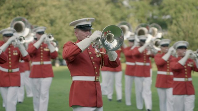 A Marine reflects at traditional Sunset Parade - BBC News