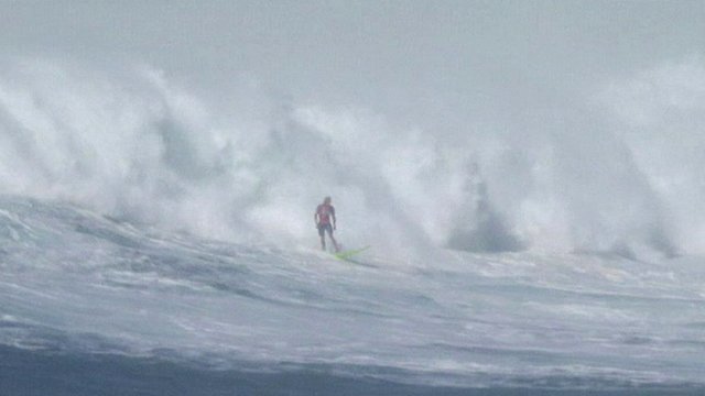 Watch this surfer perform an epic backflip over a wave - BBC Newsround