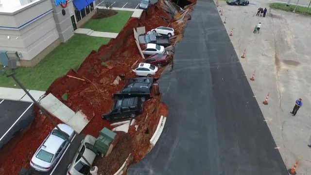 Giant sinkhole opens up near Oregon highway - BBC News